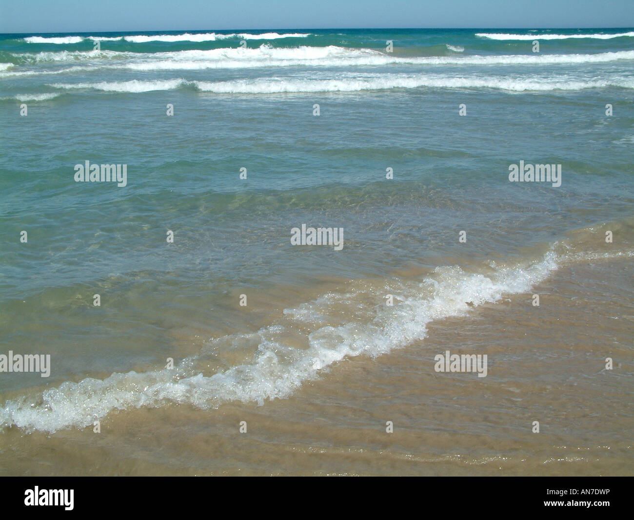 waves breaking on beach, San Juan Playa, Alicante, Spain Stock Photo ...