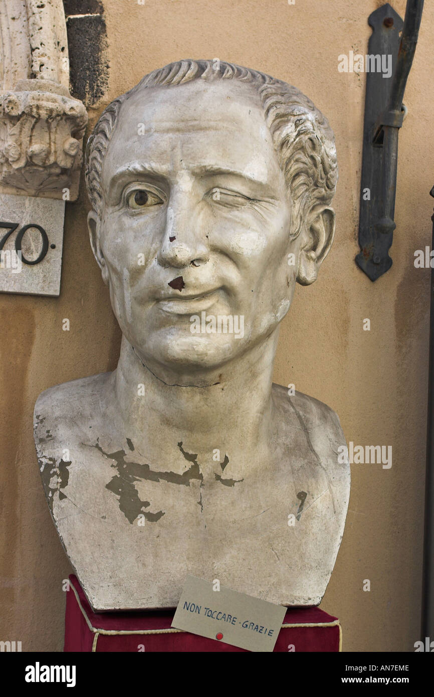 A bust or statue of a roman caesar with one eye winking Stock Photo - Alamy