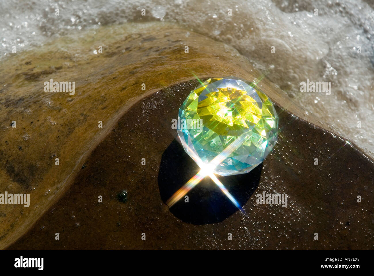 Glass ball crystal ball on pebble beach Stock Photo - Alamy