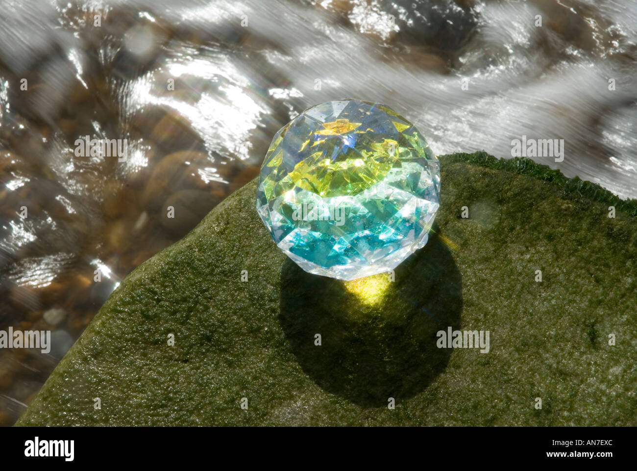 crystal cut glass object on pebble beach Stock Photo - Alamy