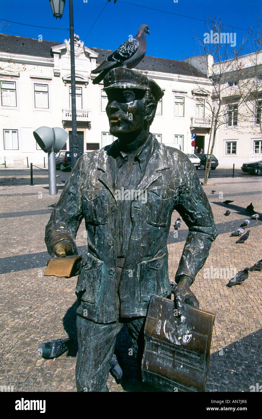 A lifesize statue of a lottery seller a perch for pigeons stands in the ...
