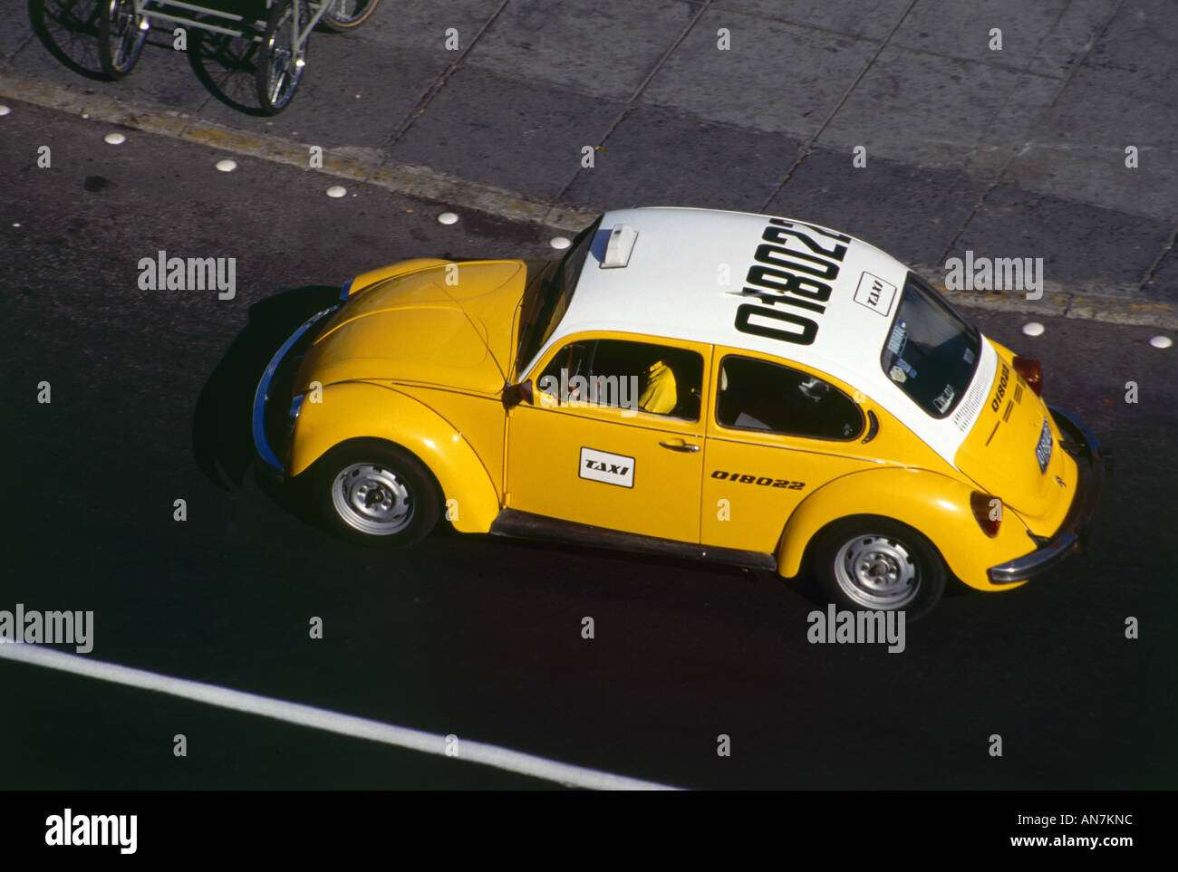 One of the ubiquitous taxis all of them Volkswagen beetles in a variety ...