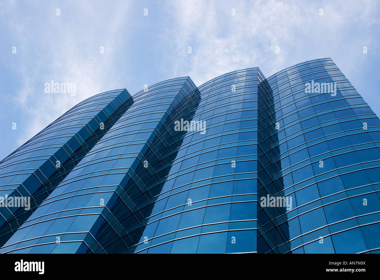Office building in blue with a blue sky as the background Stock Photo ...