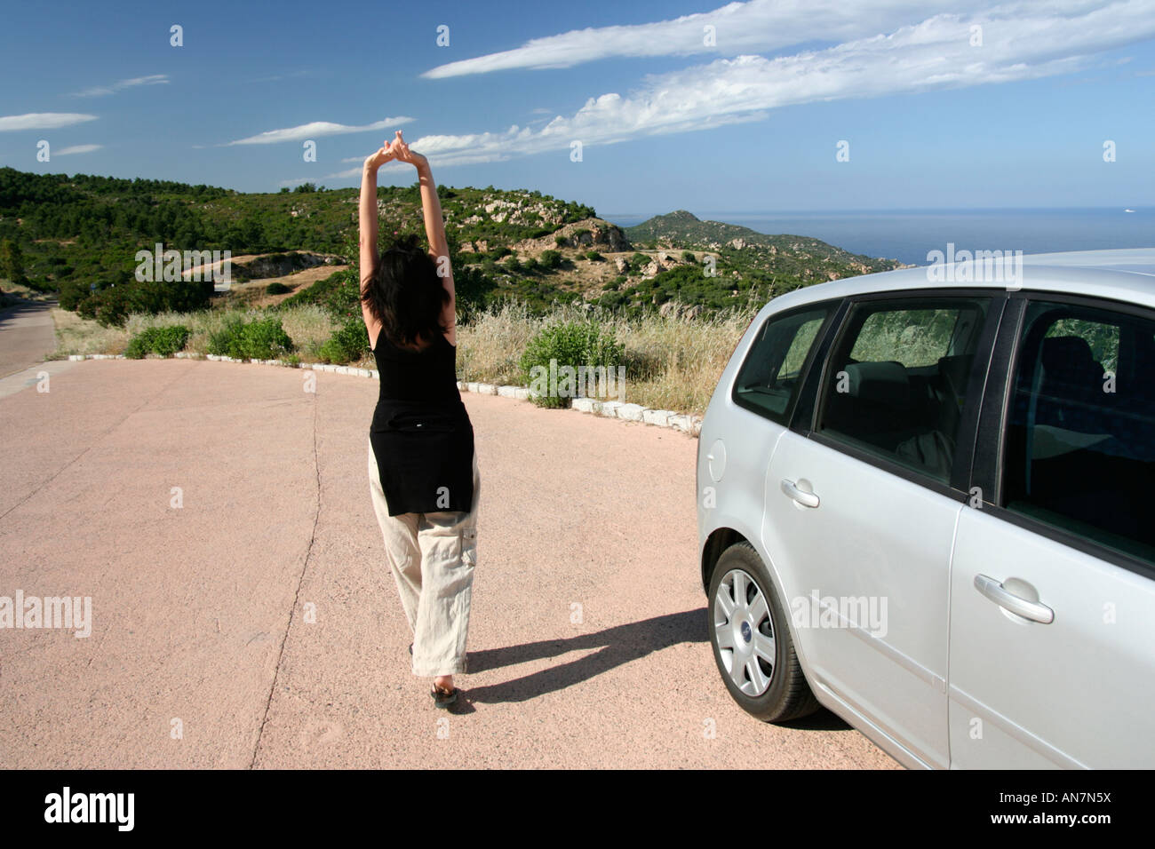 Stretching after a long car journey Stock Photo - Alamy
