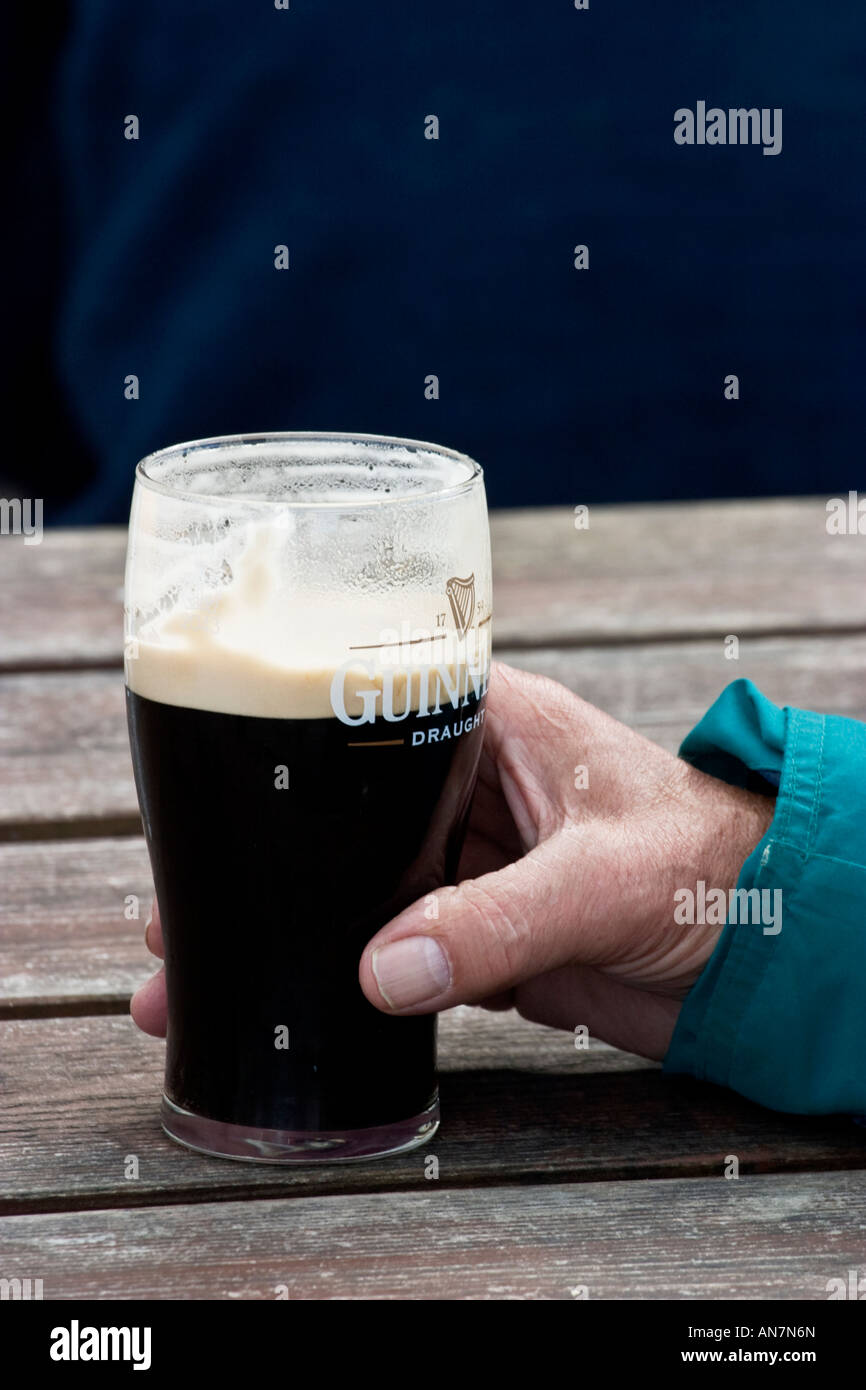 Glass of Guinness on the table Stock Photo - Alamy