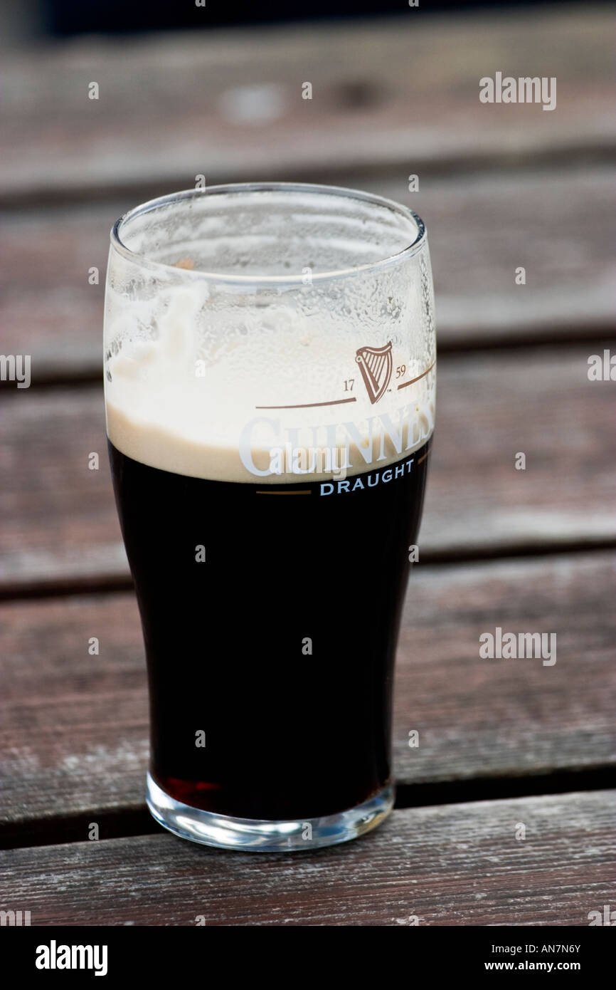 Glass of Guinness on the table Stock Photo - Alamy