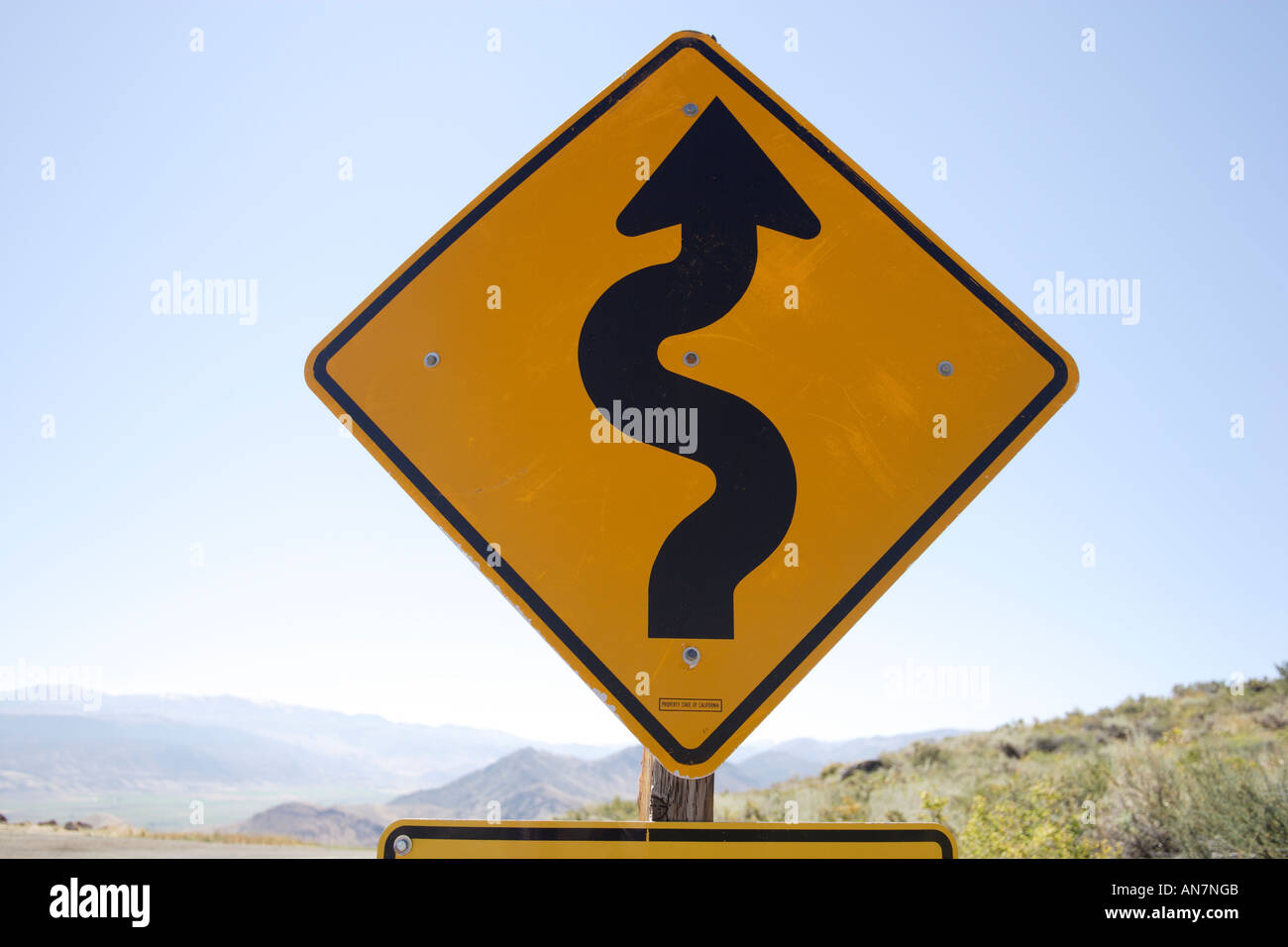 Winding road warning sign California USA Stock Photo - Alamy
