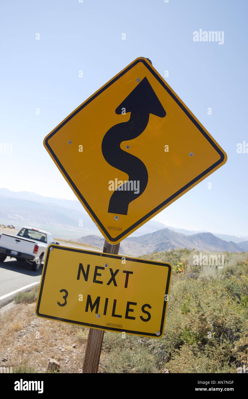 Winding road warning sign California USA Stock Photo - Alamy