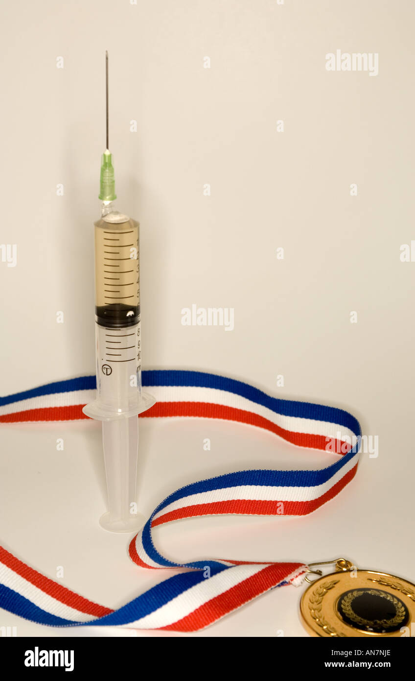 Gold medal and ribbon with hypodermic syringe Stock Photo - Alamy