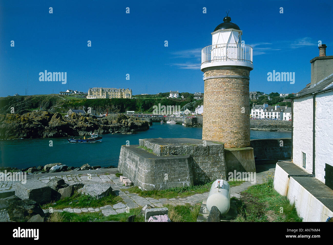 The old lighthouse and harbour at Portpatrick Stock Photo - Alamy