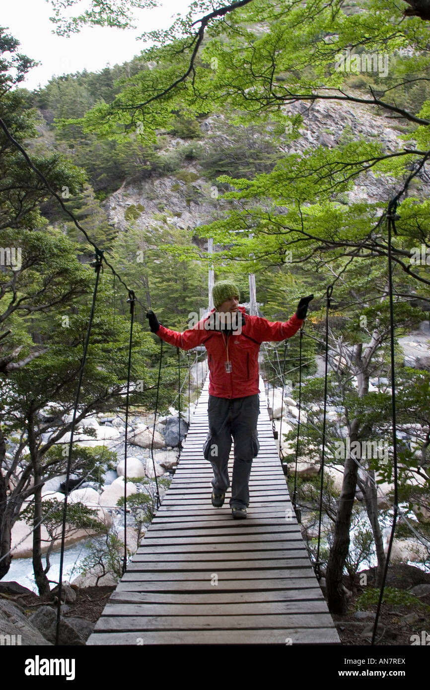 Man crossing rope bridge in hi-res stock photography and images - Alamy