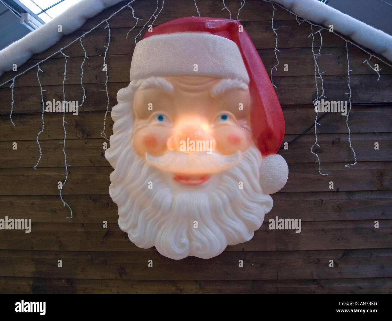 Santa Claus face Christmas decoration lit from behind Stock Photo - Alamy