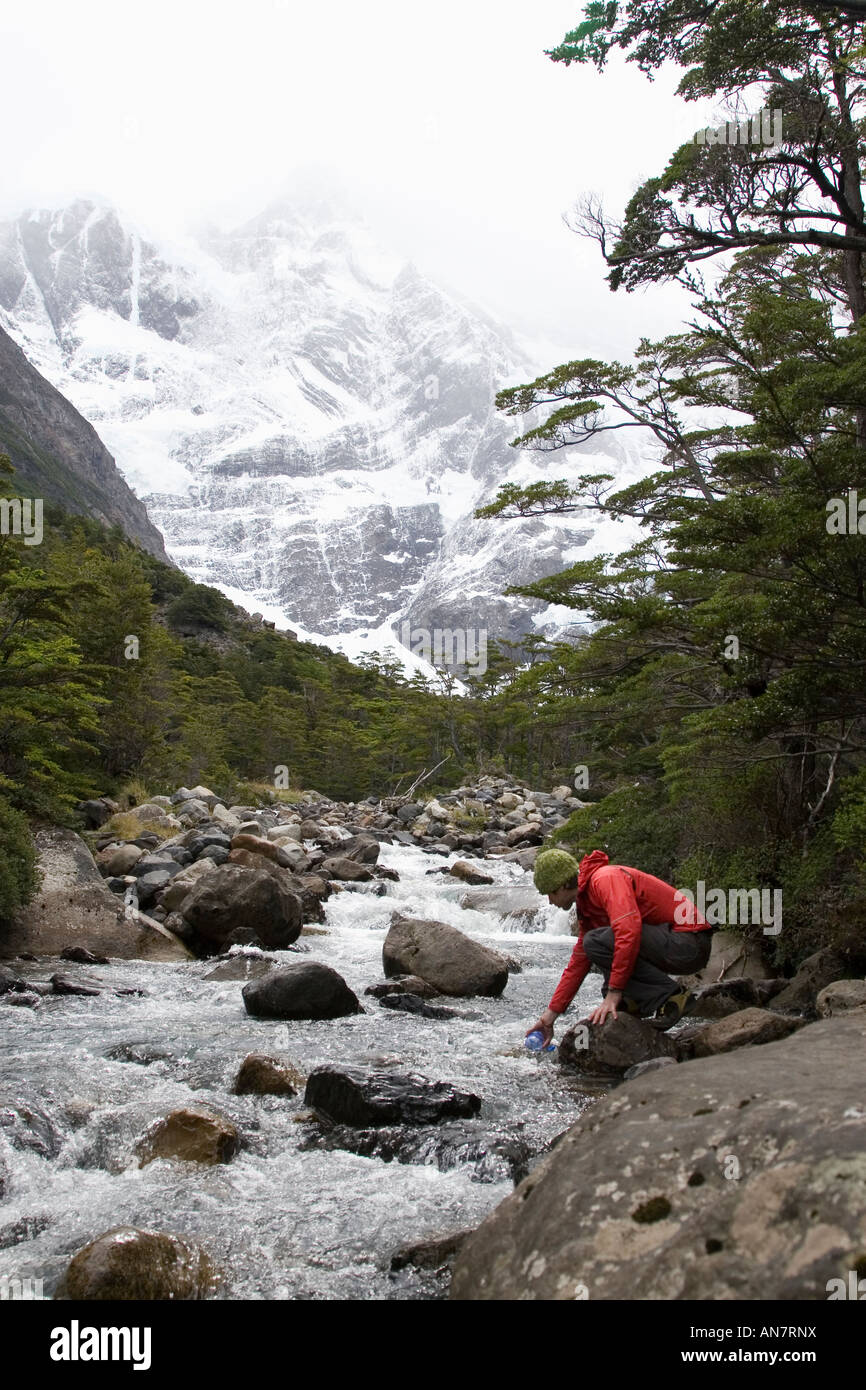 Man Collecting Water from Stream Stock Photo - Alamy