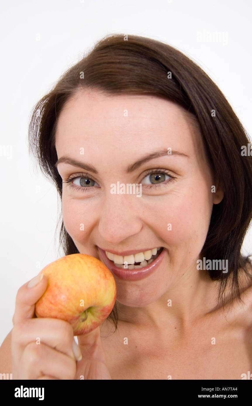 woman biting into an apple Stock Photo - Alamy