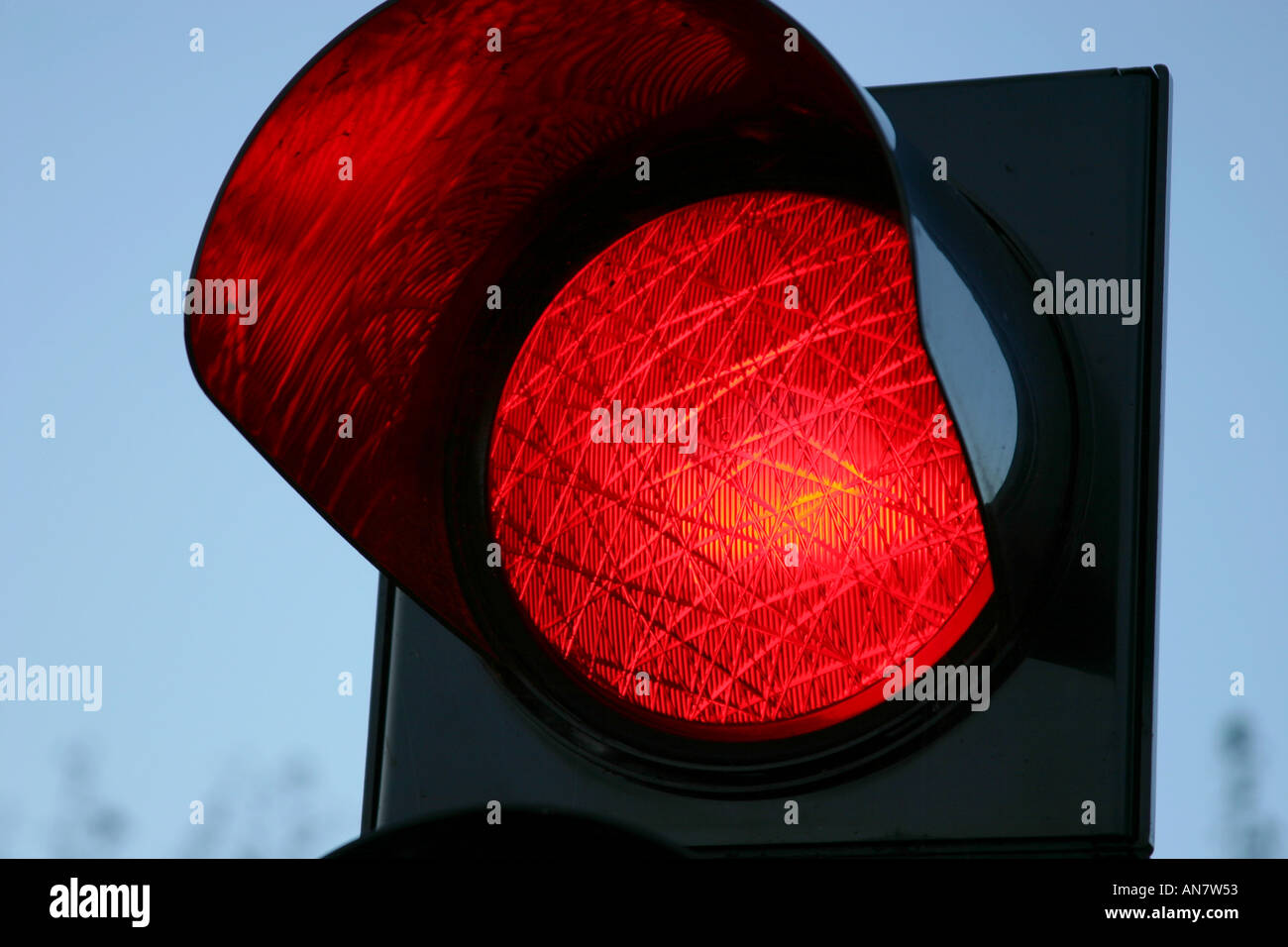Modern red traffic light illuminated Stock Photo - Alamy