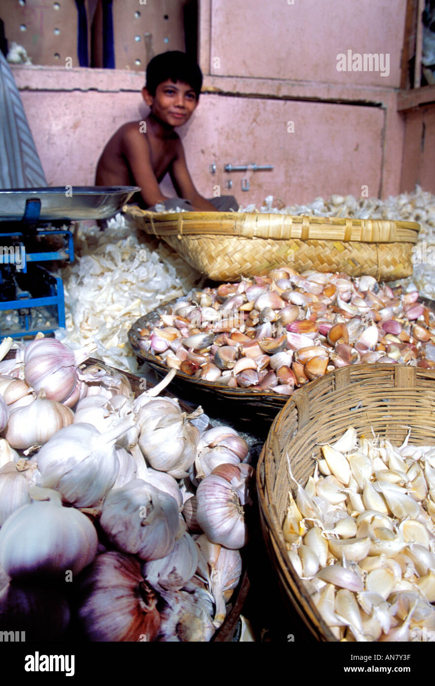 Baskets with garlic and a little vendor boy pulling a charming smile ...