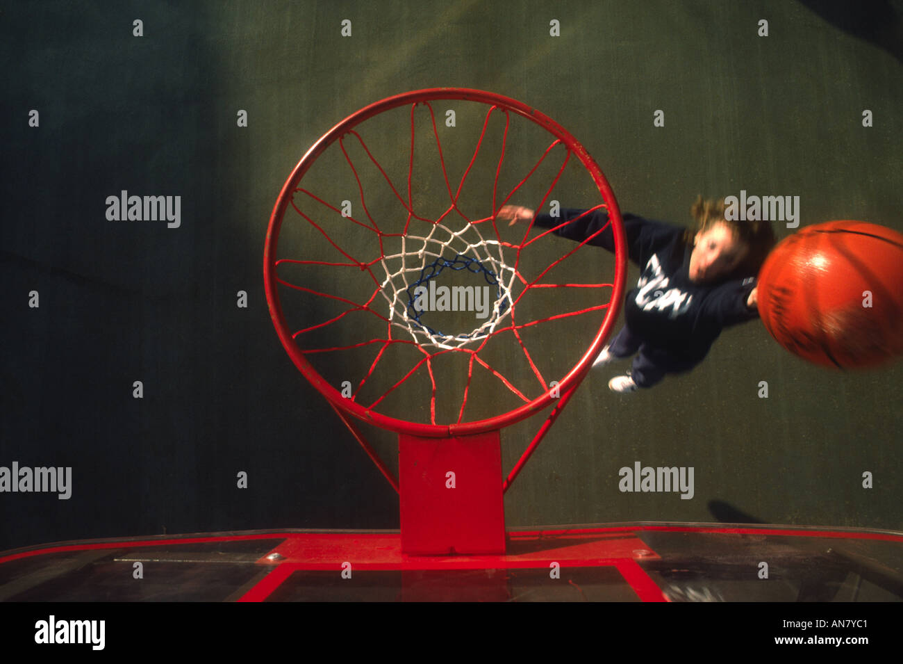 An overhead view of a woman doing a layup on a basketball court Stock ...