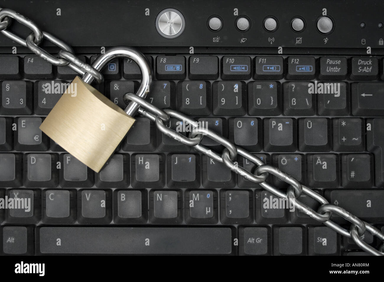 Padlock and chain locking a laptop keyboard Stock Photo - Alamy