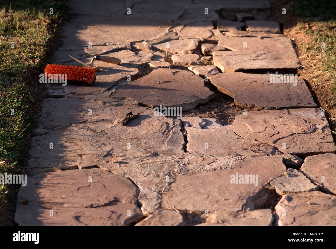 Stone pavement under construction and tools Stock Photo - Alamy
