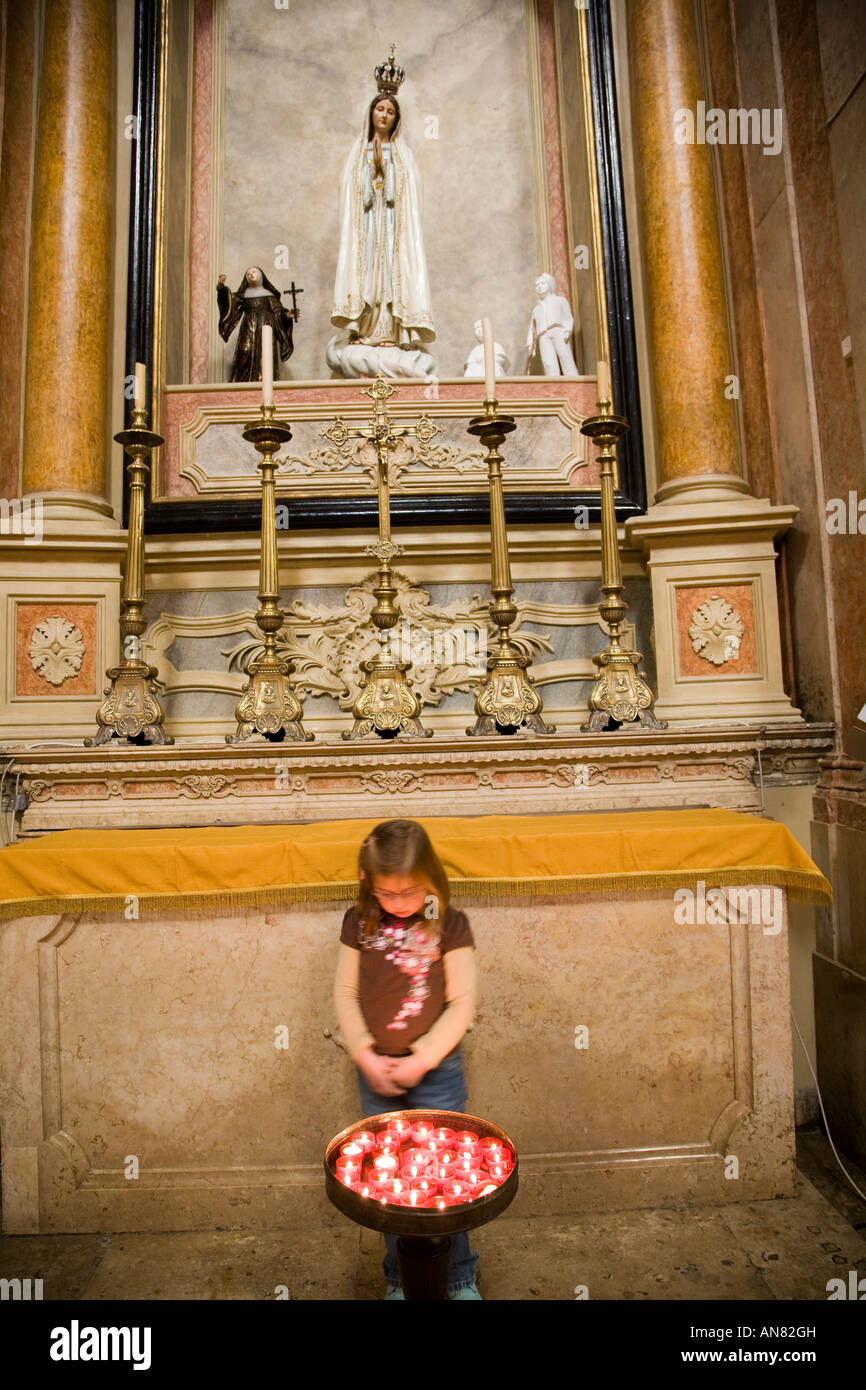 A child looking at candles, Encarnaçao church, Lisbon Stock Photo - Alamy