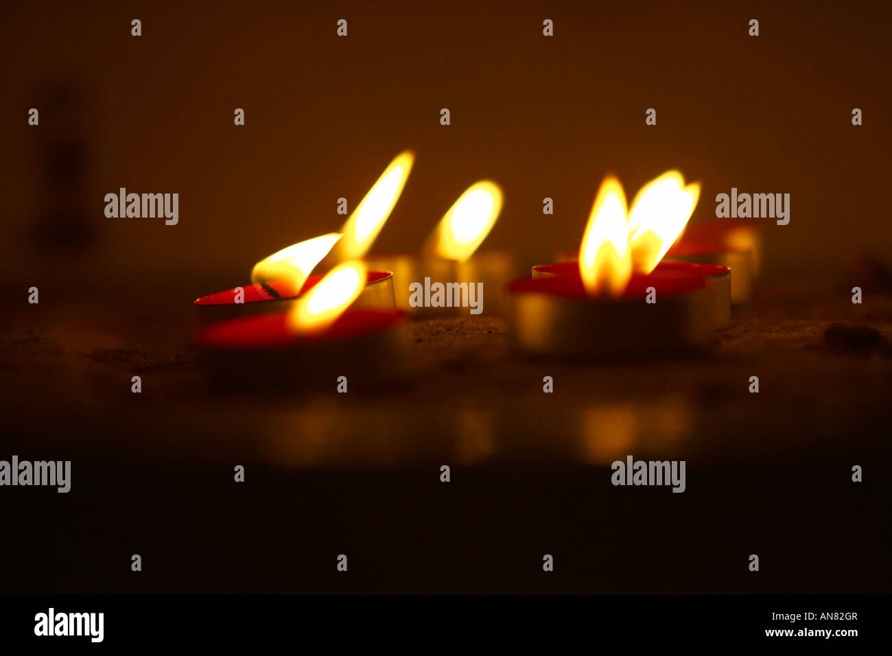 selection of candles as an offering in a church Stock Photo - Alamy