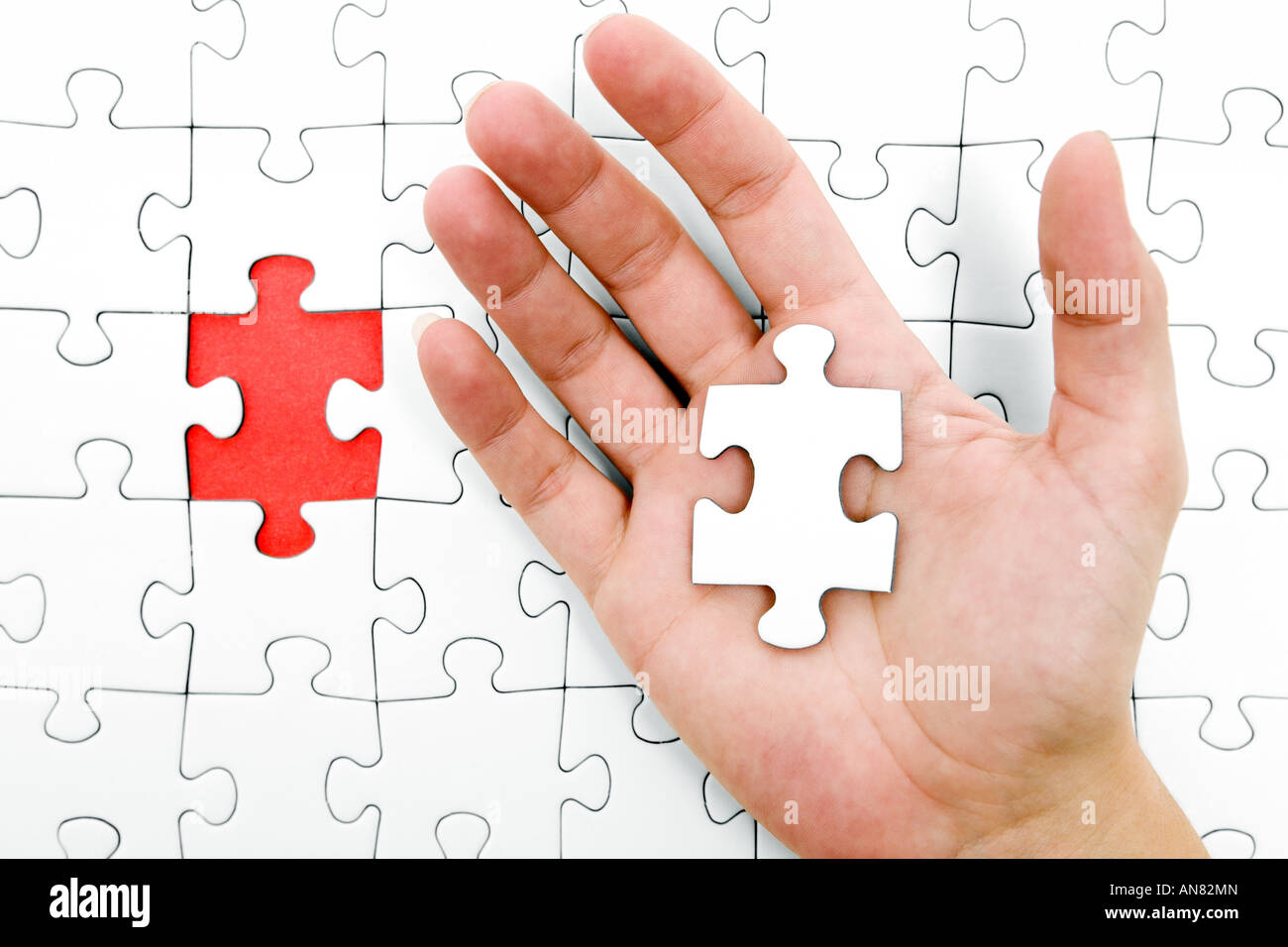 Open hand with the missing puzzle piece Stock Photo - Alamy
