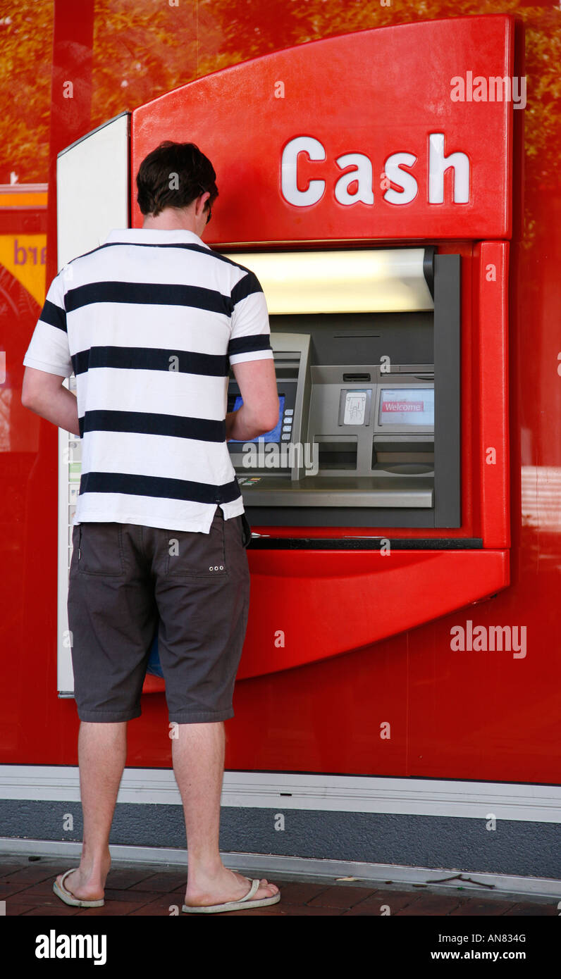 Man using ATM Stock Photo - Alamy