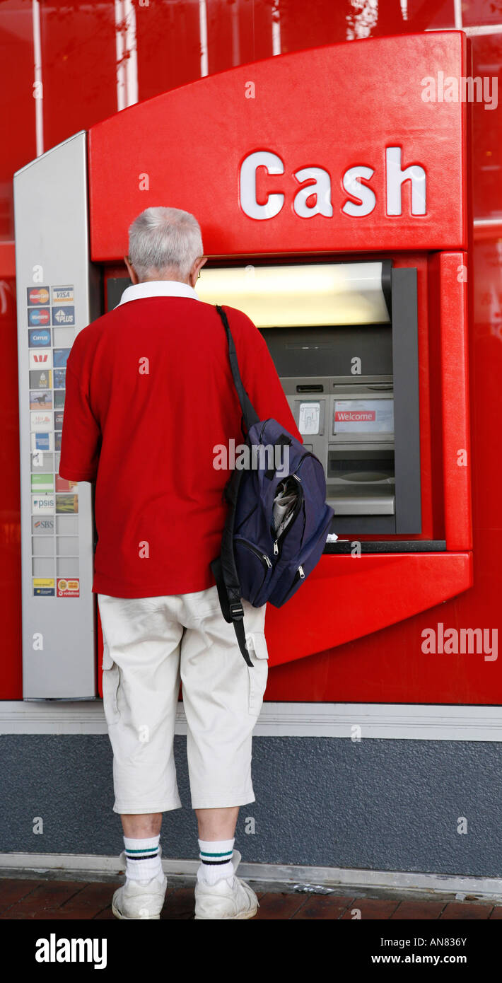 Man using ATM Stock Photo - Alamy