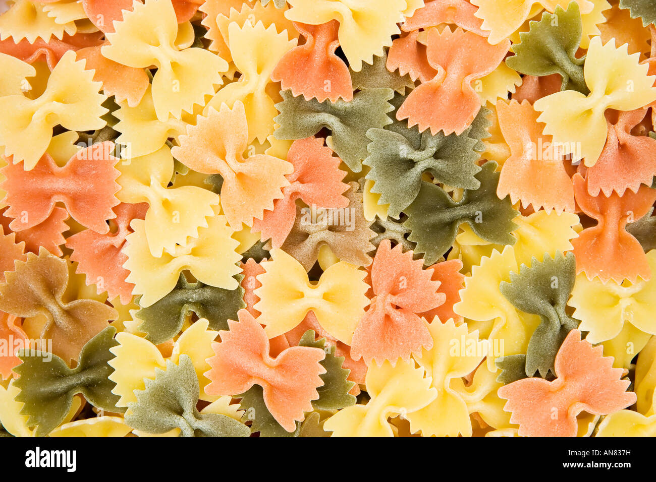 Colored pasta forming a appetizingly background Stock Photo - Alamy
