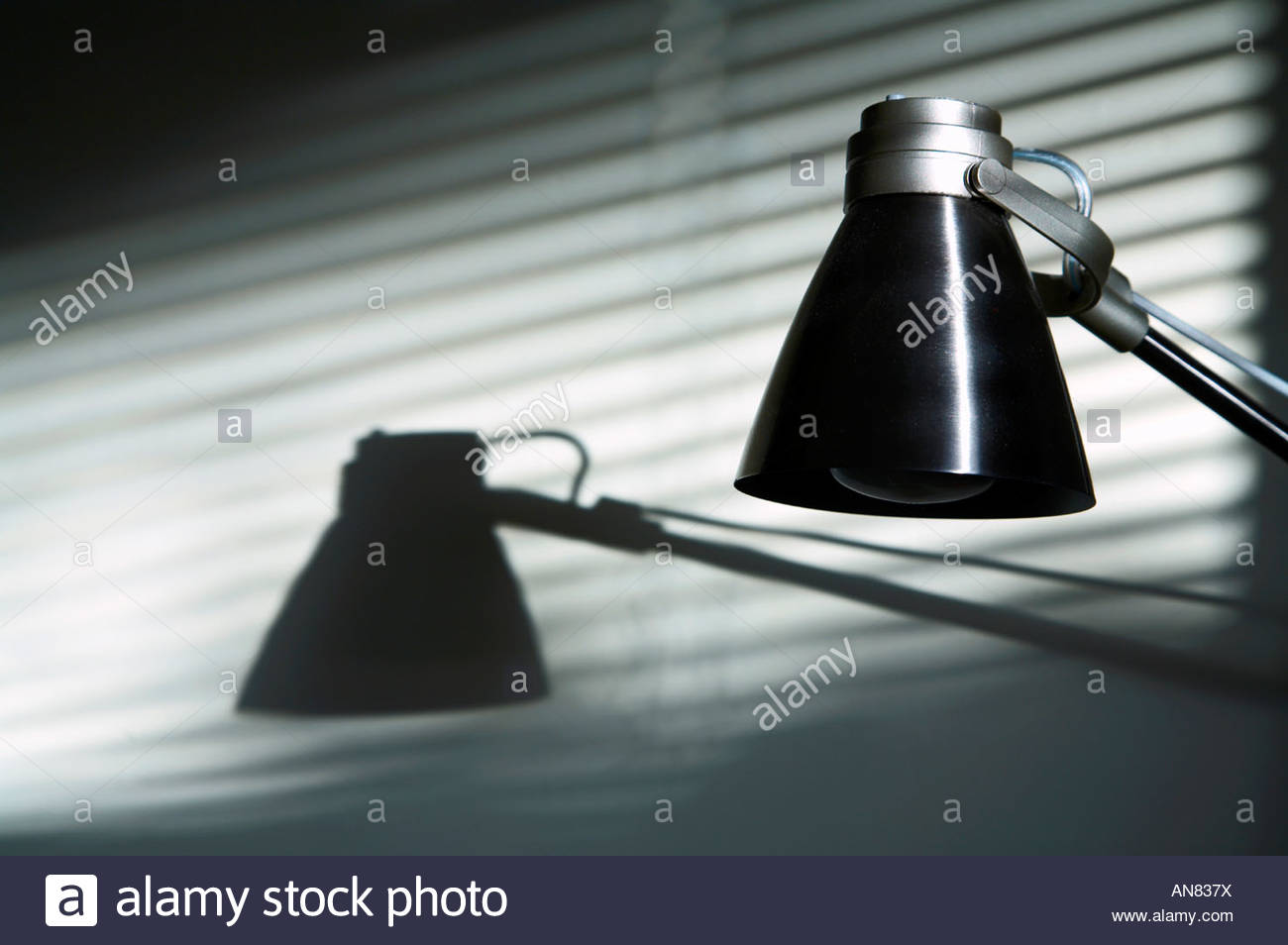 Desk lamp and shadow Stock Photo - Alamy
