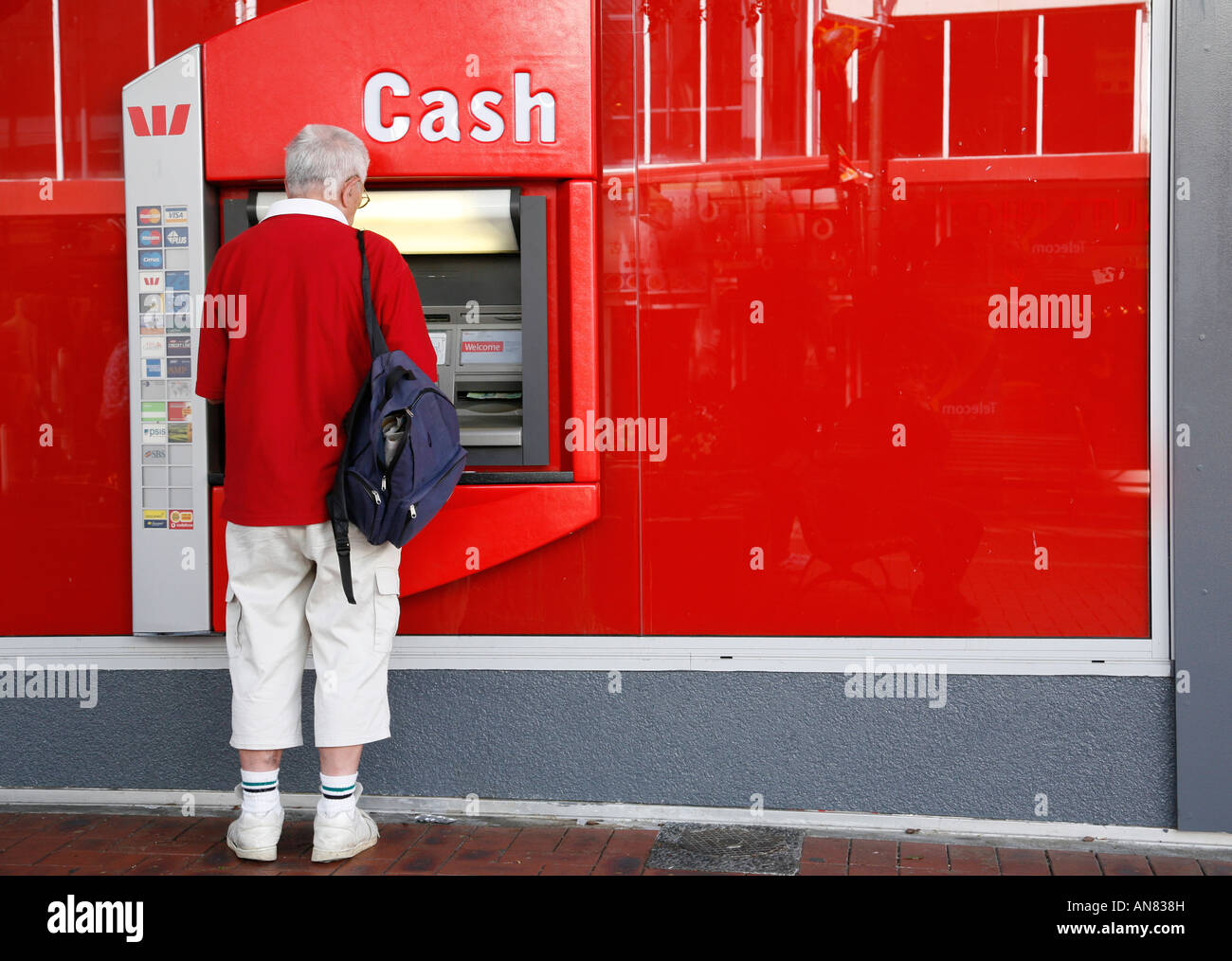 Man using ATM Stock Photo - Alamy