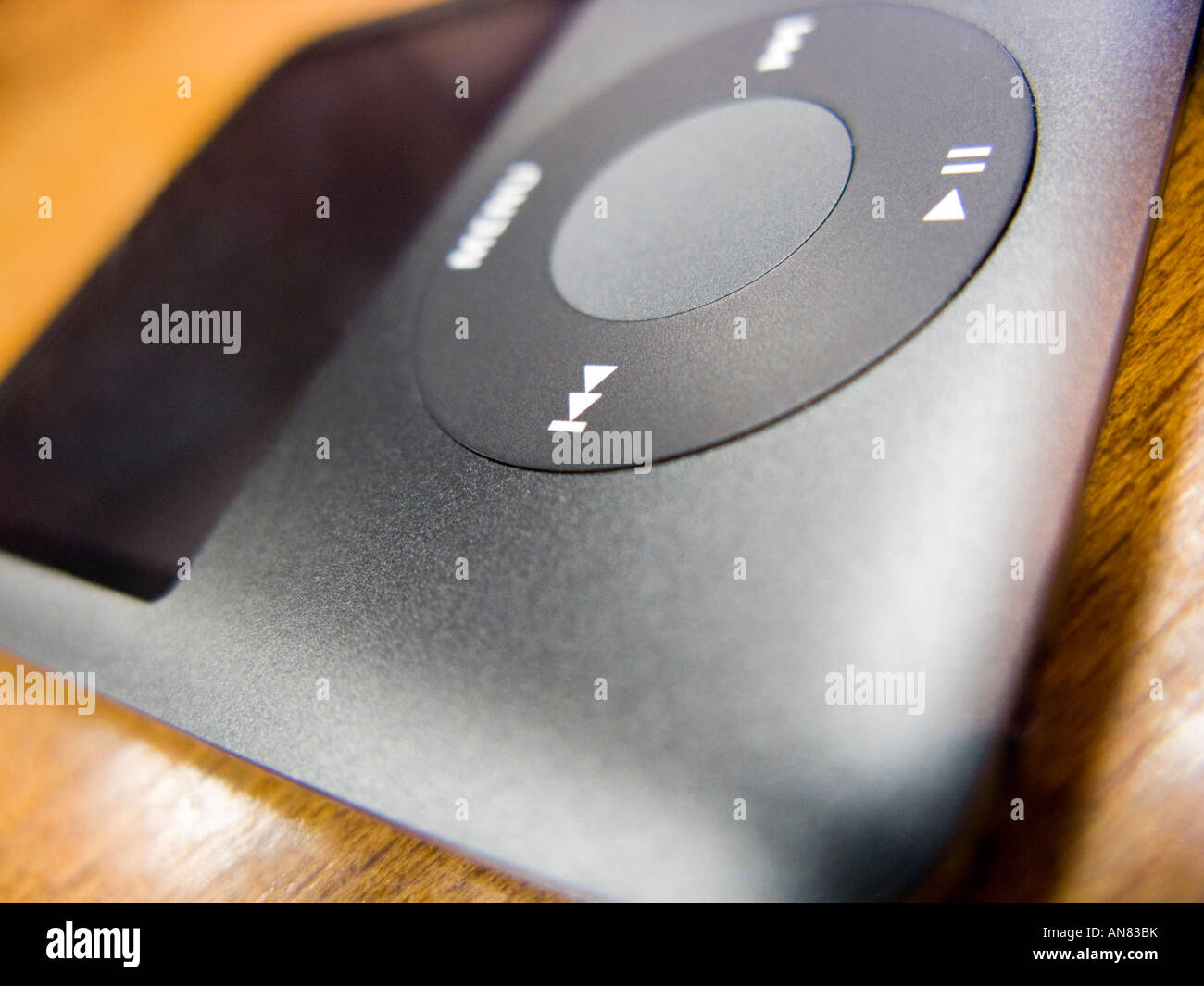 close up image of ipod on a wooden table top Stock Photo - Alamy