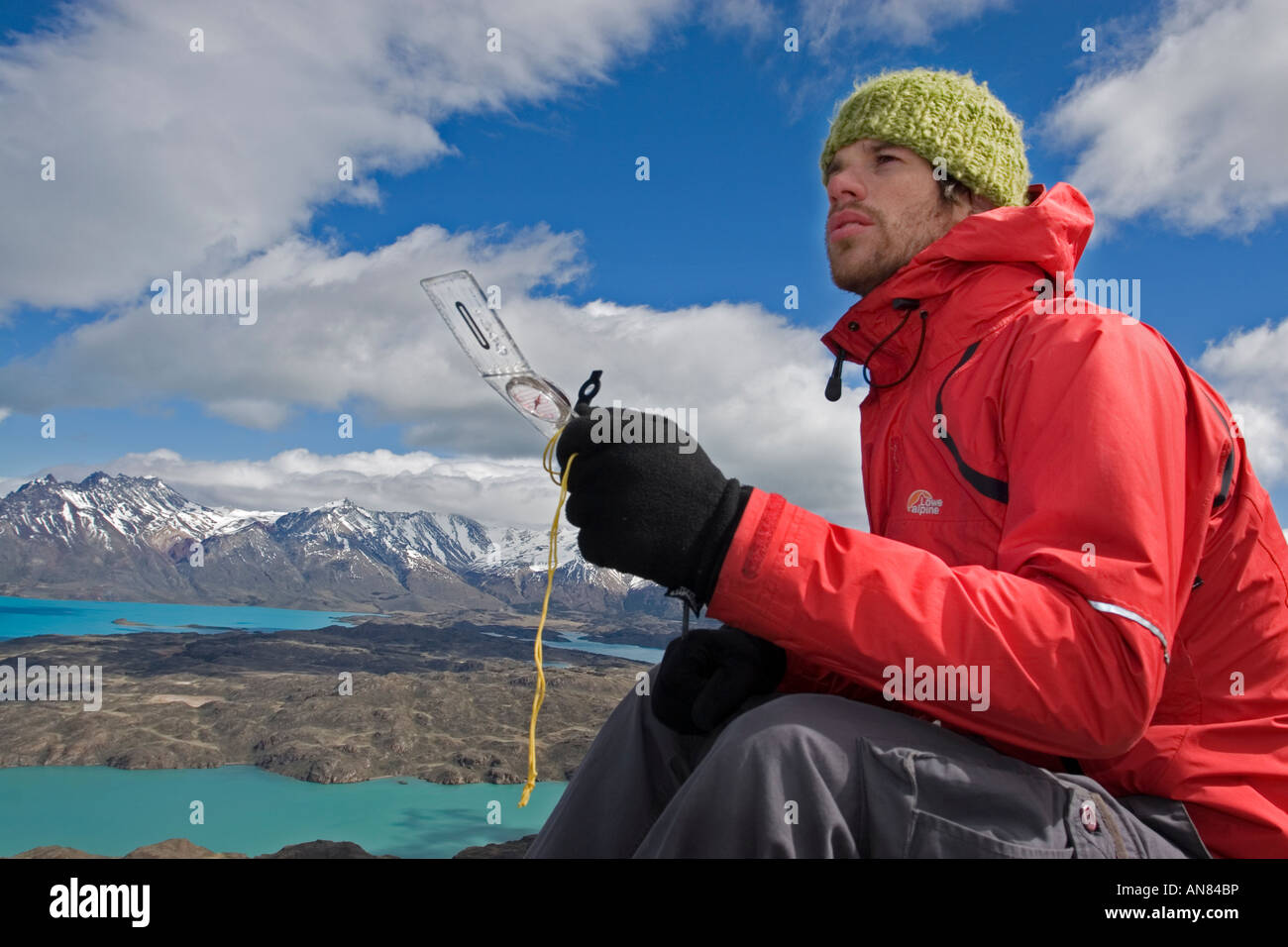 A man holding a compass Stock Photo - Alamy