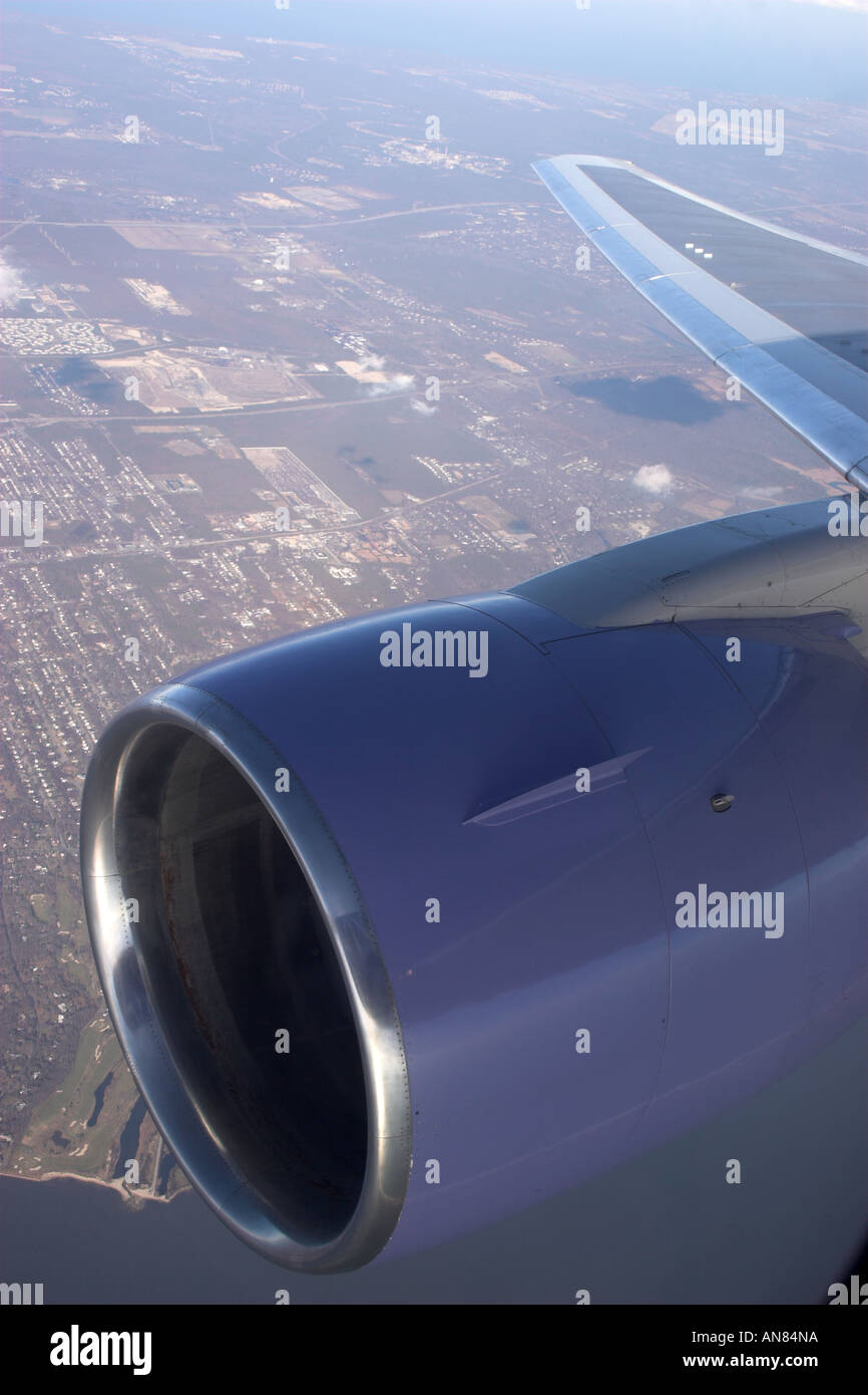 View out Aircraft window engine landing Stock Photo - Alamy