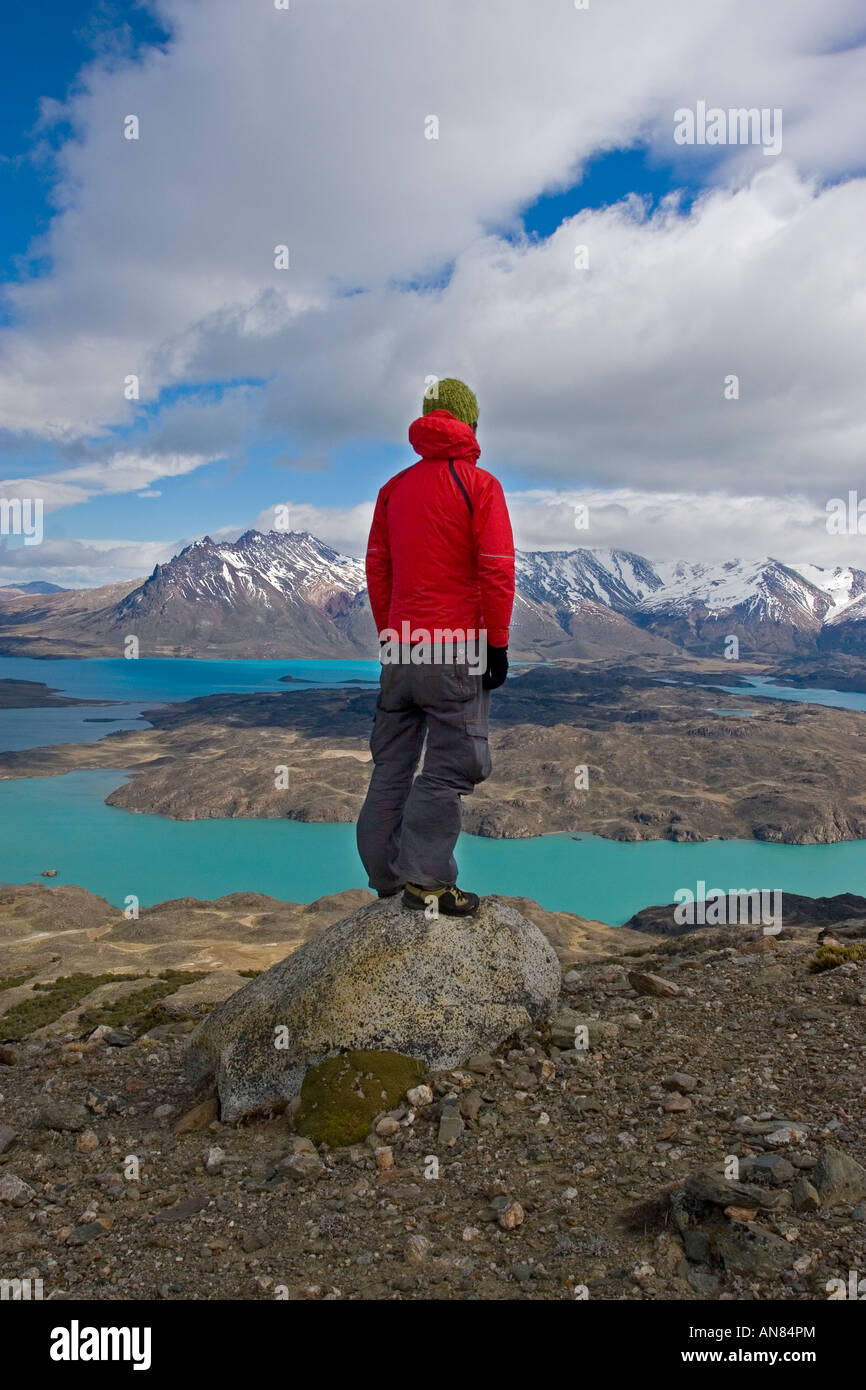 Figure in Red Looking at View Stock Photo - Alamy