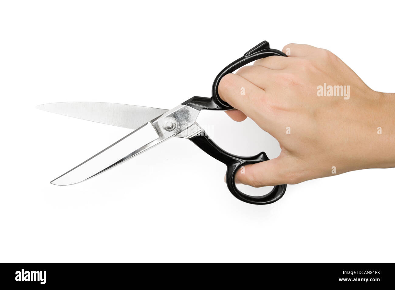 Female hand holding a pair of sharp scissors. Isolated on a white ...