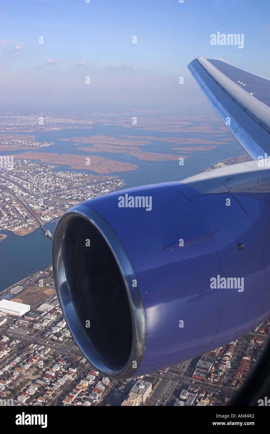 View out Aircraft window engine landing Stock Photo - Alamy