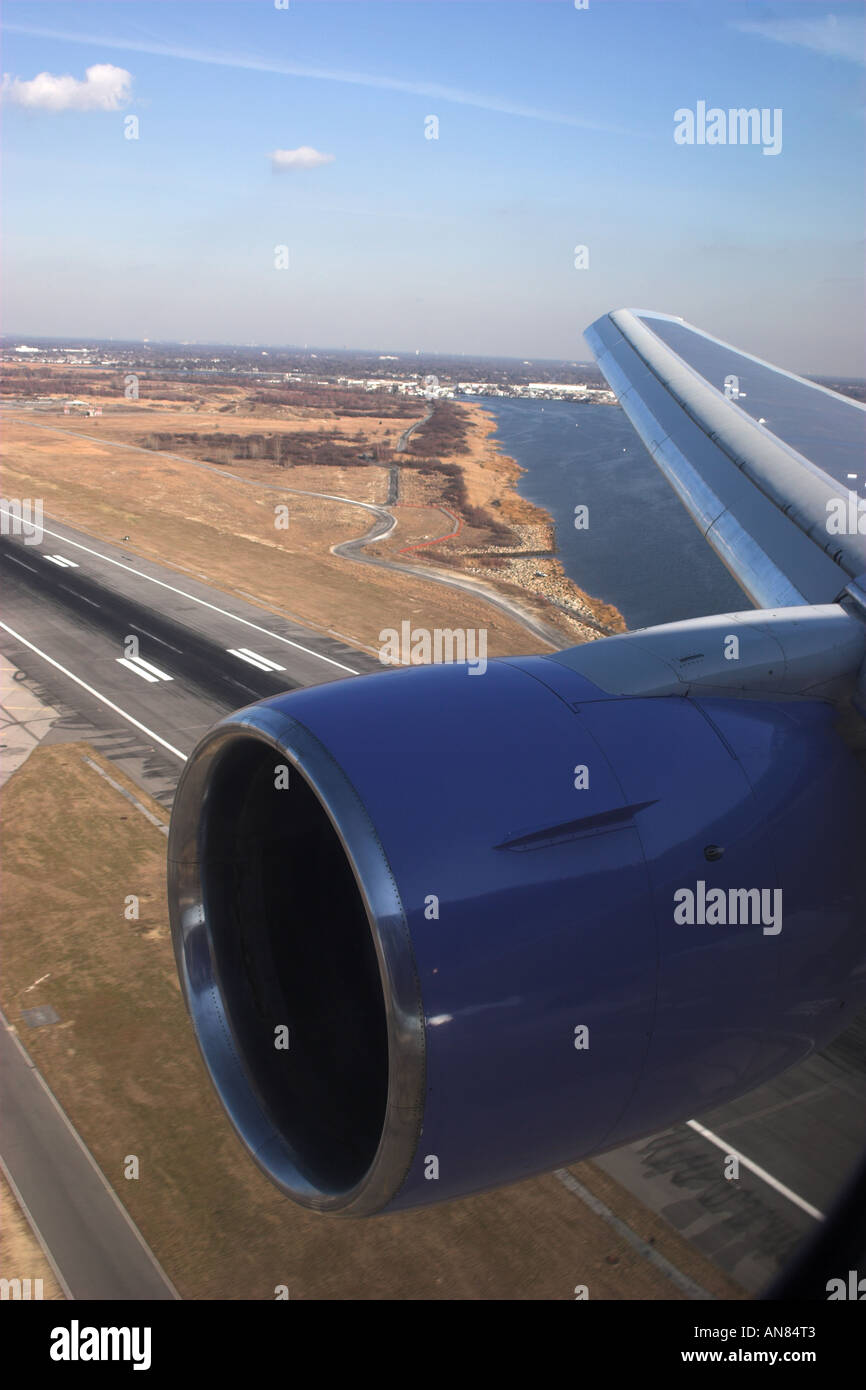 View out Aircraft window engine landing Stock Photo - Alamy