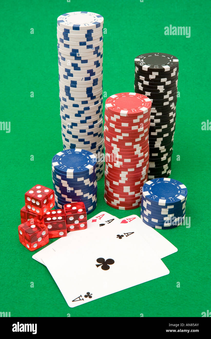 Poker set isolated on green poker table felt Stock Photo - Alamy