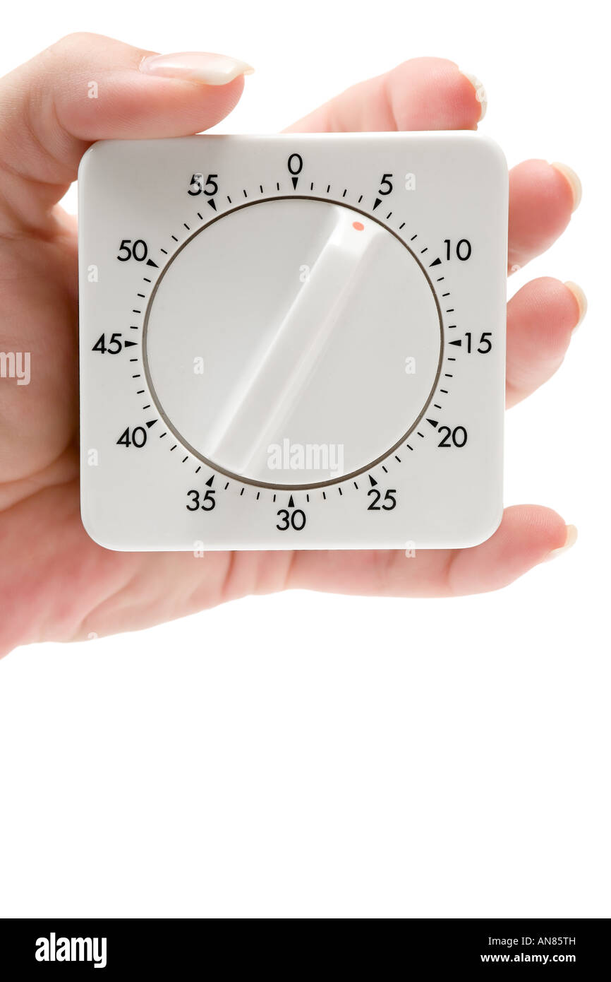 Female hand holding a timer. Isolated on a white background Stock Photo ...
