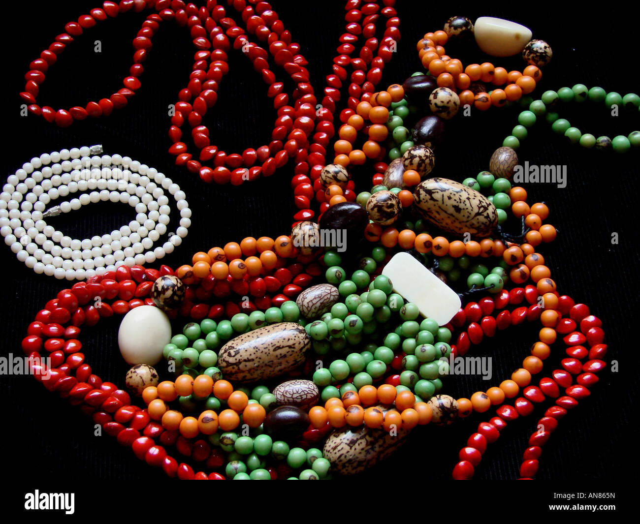 Brazilian seeds red orange nature black hi-res stock photography and ...