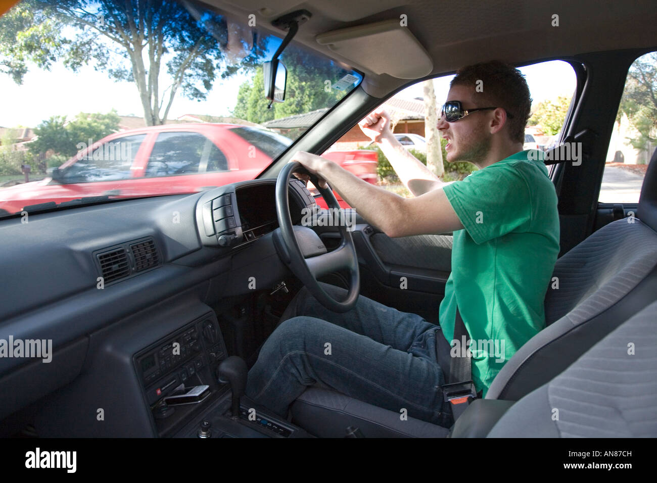 young man with road rage anger Stock Photo - Alamy