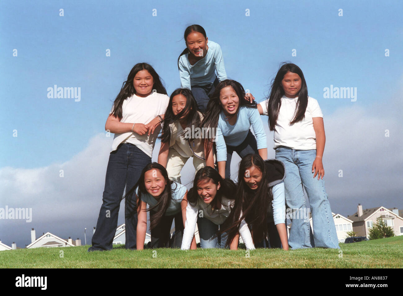 8 Asian American girls forming a pyramid Stock Photo - Alamy
