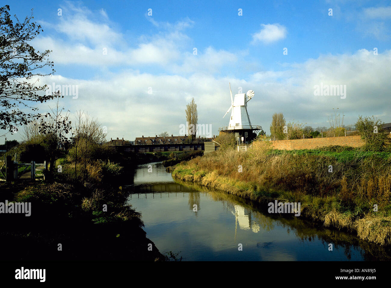 An old white windmilll along by the river in rye Stock Photo - Alamy