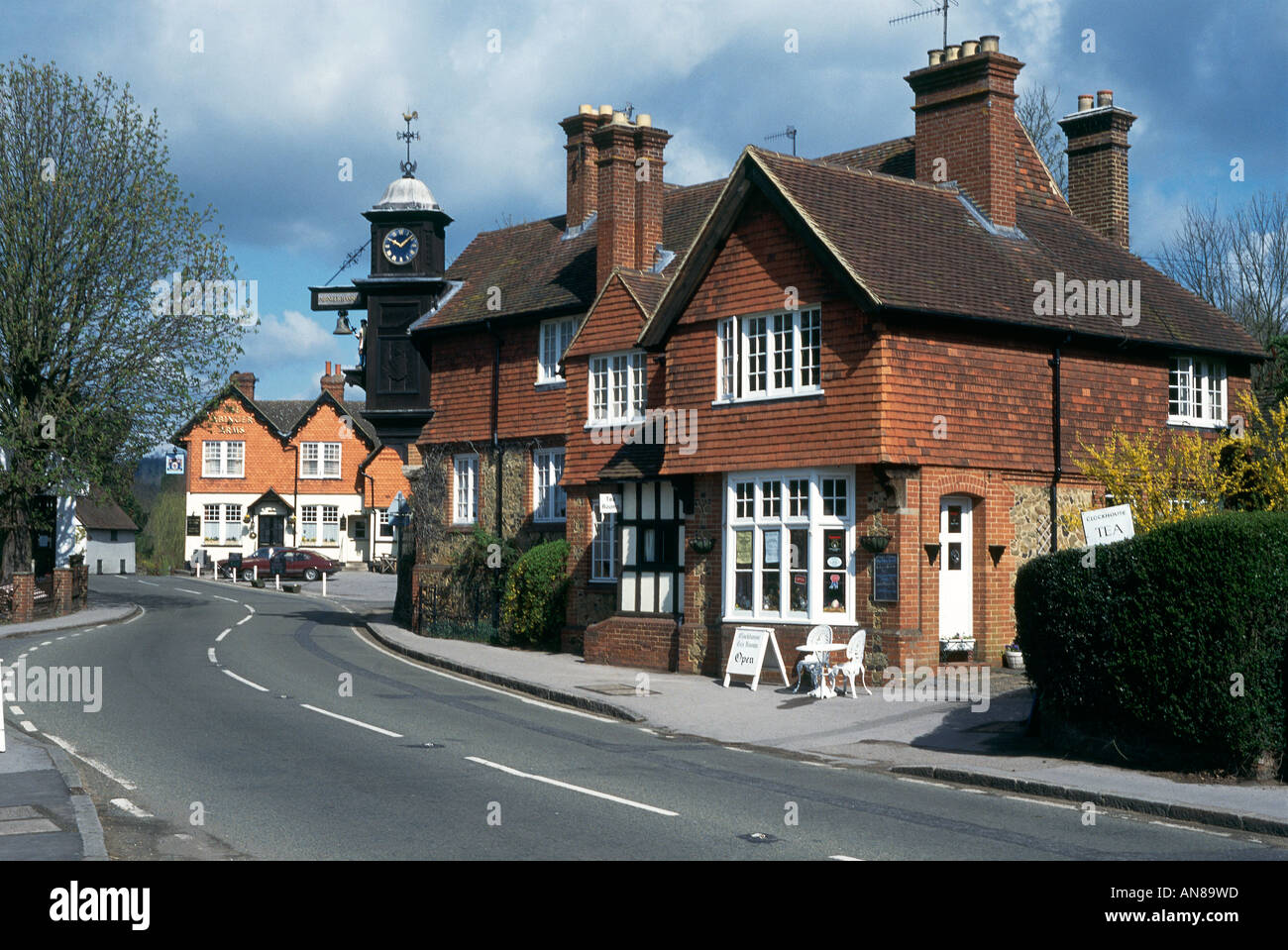 The main road in Abinger Hammer cafe in the foreground and a timber ...