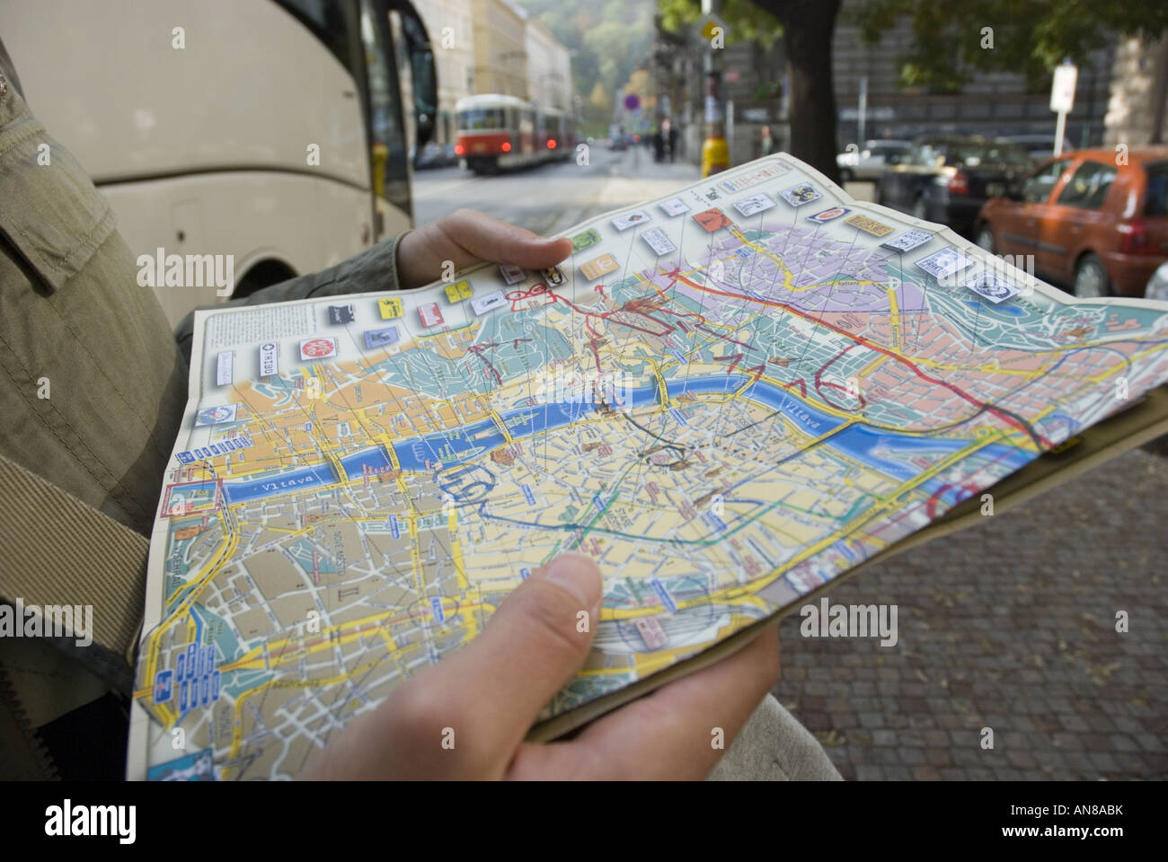 Consulting a city map with marked tram routes in Prague Czech Republic ...