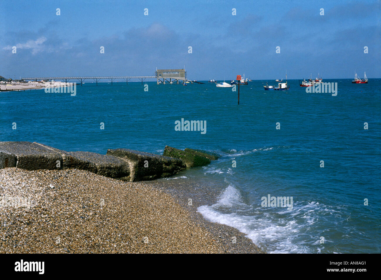 A view of the sea lapping against the coastal groins Stock Photo - Alamy