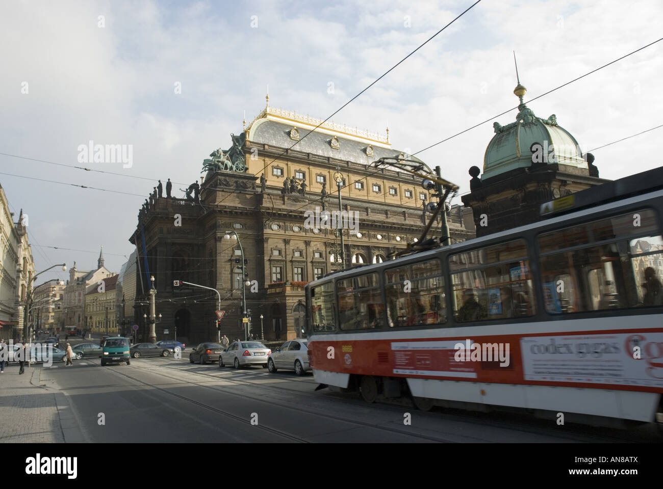 An inner city tram speeds past the National Theatre, Prague Czech ...