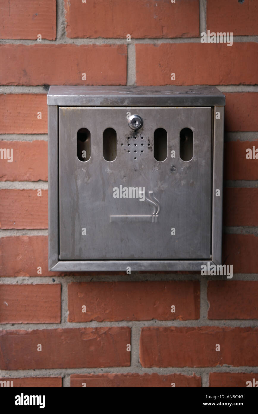 Ashtray outside mounted on a red brick wall Stock Photo - Alamy