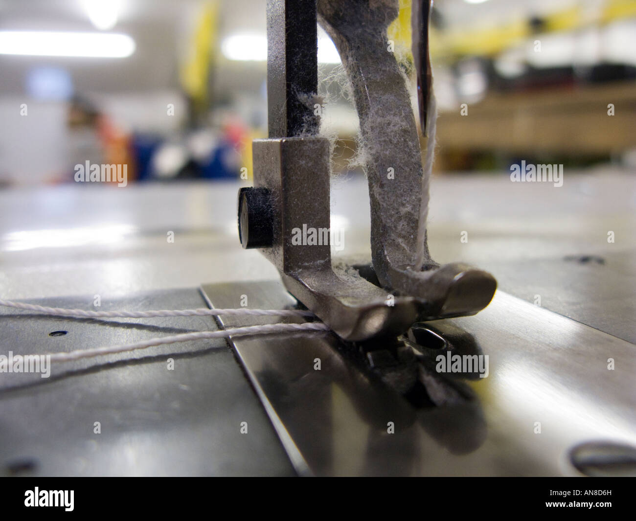 close up colour image off the needle and the foot on a old sewing ...